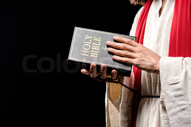 Cropped view of holding holy bible ... | Stock image | Colourbox