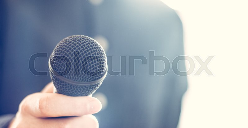 Interview: Black microphone in the ... | Stock image | Colourbox