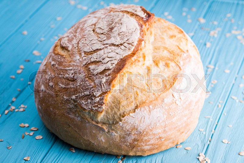 Big loaf of bread on a wooden table | Stock image | Colourbox