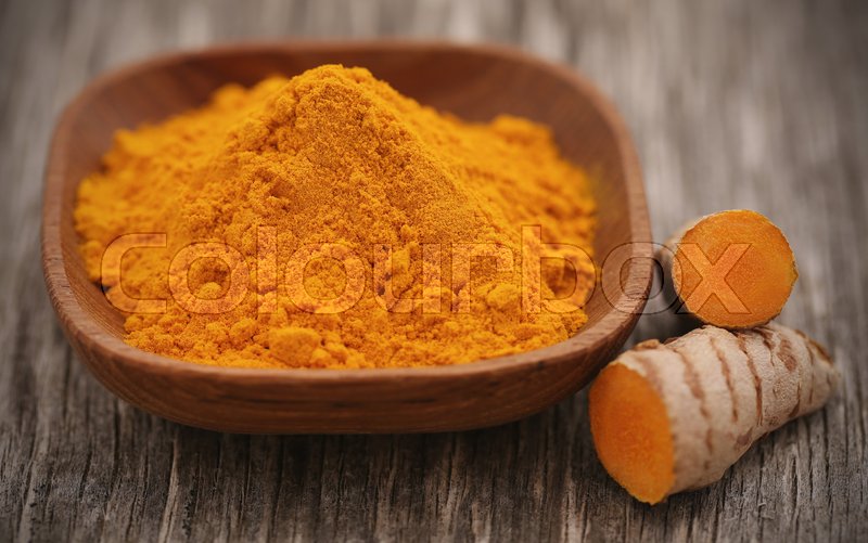 Raw turmeric with powder in a bowl on ... | Stock image | Colourbox