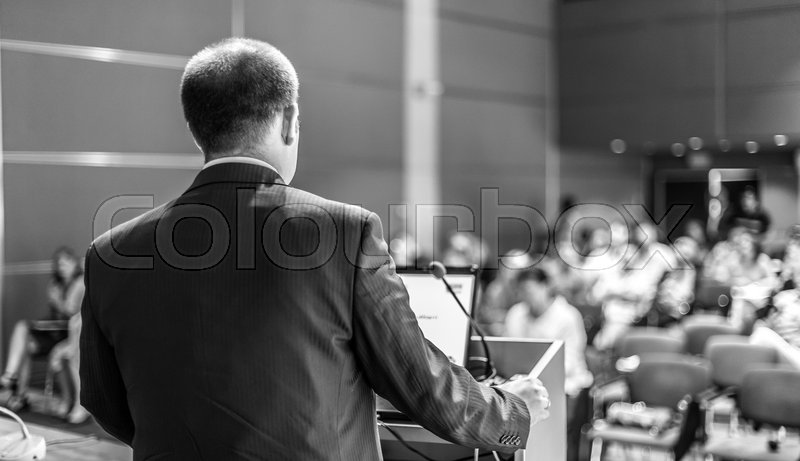 Speaker giving a talk on corporate ... | Stock image | Colourbox