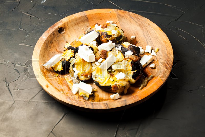 Baked Potatoes cooked in the burned ... | Stock image | Colourbox