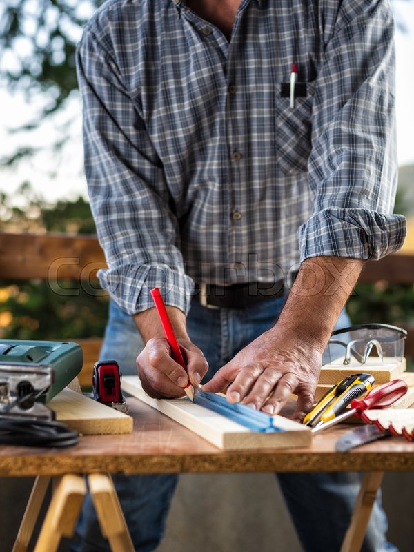 Adult craftsman carpenter with pencil ... | Stock image | Colourbox