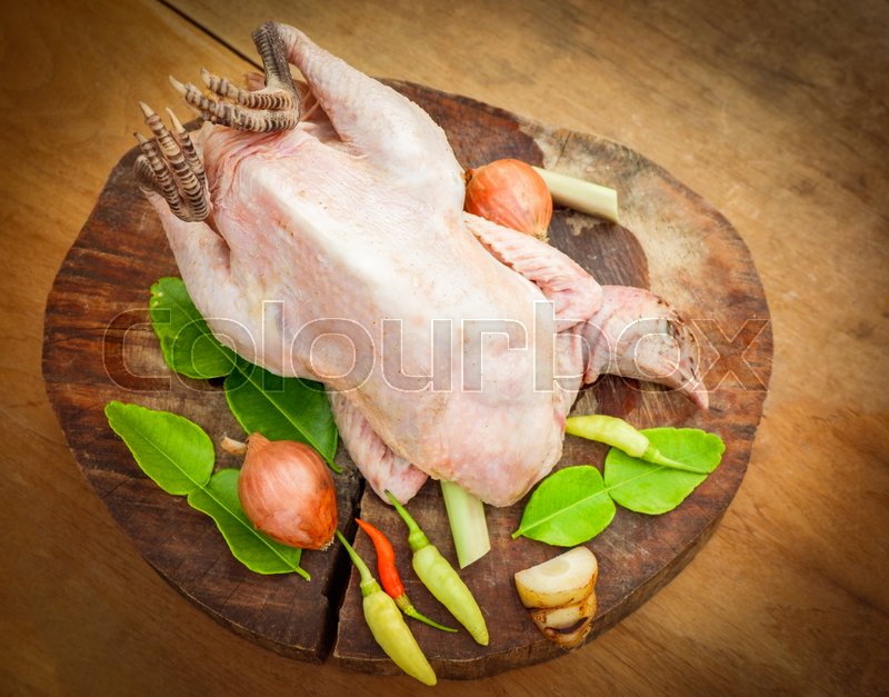 Chicken on chopping board / raw chicken ... | Stock image | Colourbox