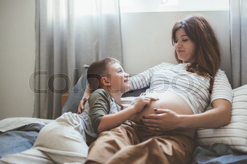 Pregnant Mom Talking And Playing With Stock Image Colourbox