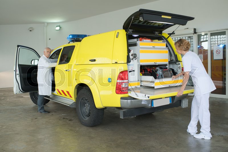 She is preparing the medical vehicle | Stock image | Colourbox