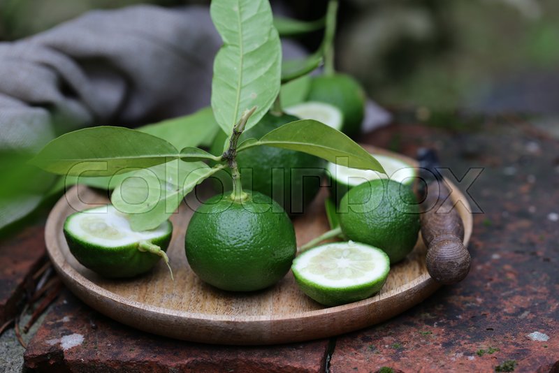 Natural organic lime with green leaves | Stock image | Colourbox