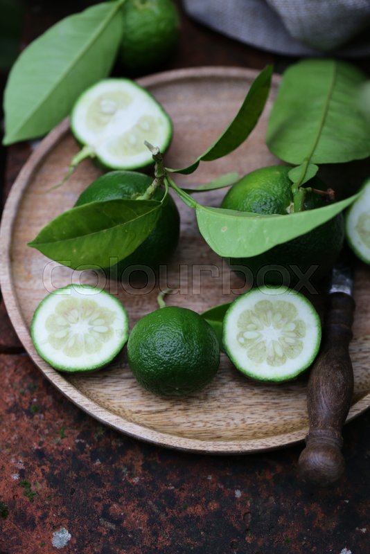 Natural organic lime with green leaves | Stock image | Colourbox