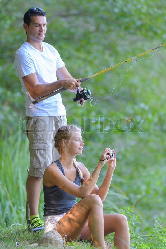 Love story couple is fishing | Stock image | Colourbox