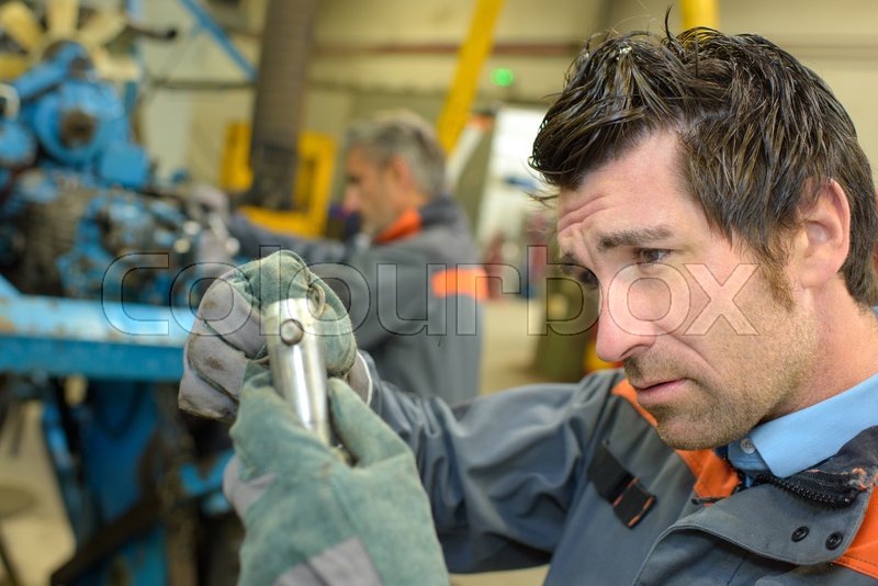 Man machinery operator working at a ... | Stock image | Colourbox