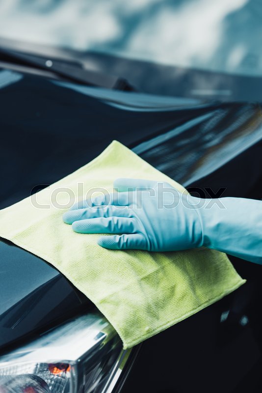 Cropped view of car cleaner wiping car ... | Stock image | Colourbox