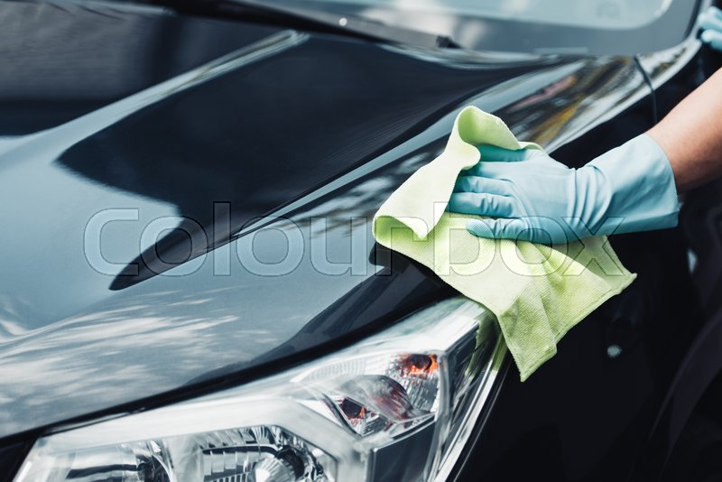 Cropped view of car cleaner wiping ... | Stock image | Colourbox