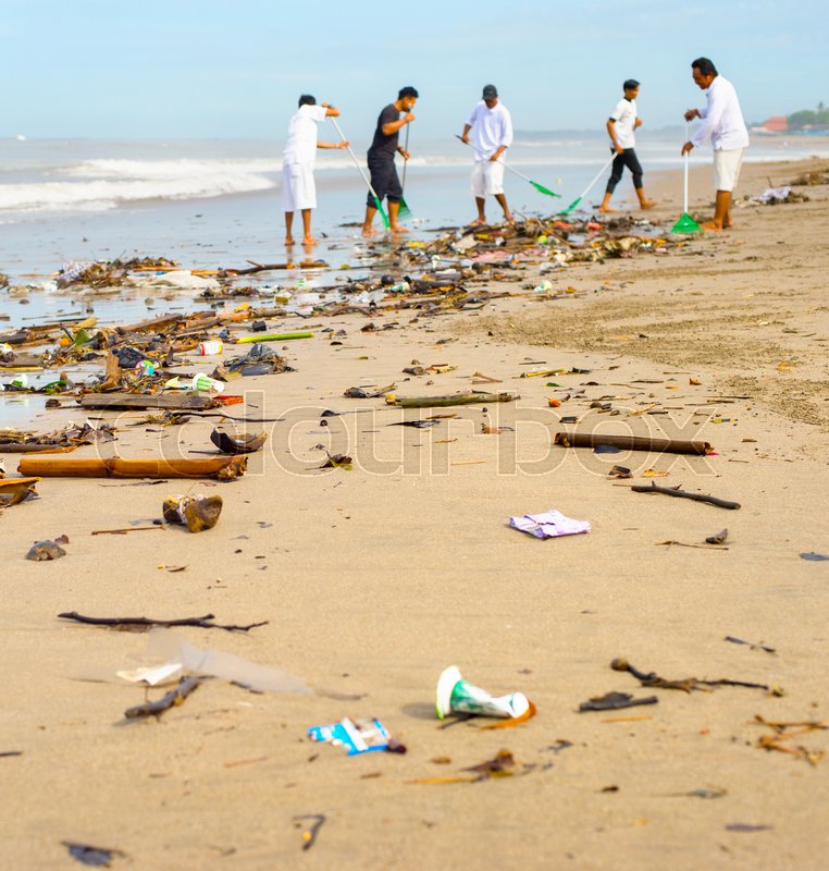 Group of people cleaning up the beach ... | Stock image | Colourbox
