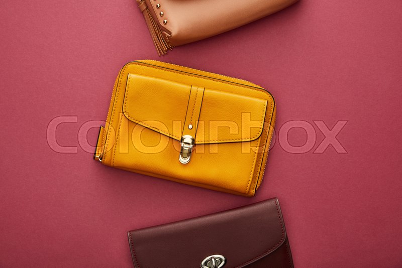 Top view of stylish bags on crimson | Stock image | Colourbox