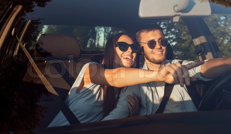Loving couple travelling by car has ... | Stock image | Colourbox