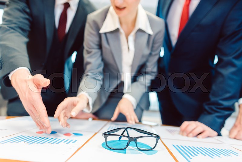 Team of financial advisors analyzing ... | Stock image | Colourbox