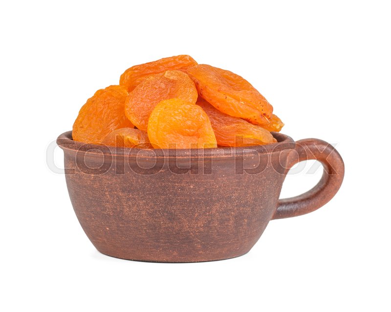 Dried apricots in a ceramic cup ... | Stock image | Colourbox