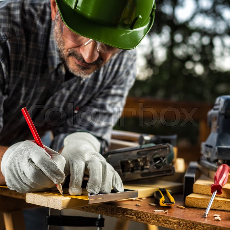 Adult carpenter craftsman wearing ... | Stock image | Colourbox