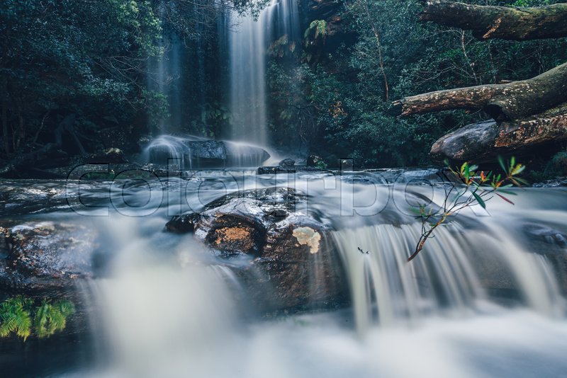 Full flowing waterfall and cascades in ... | Stock image | Colourbox