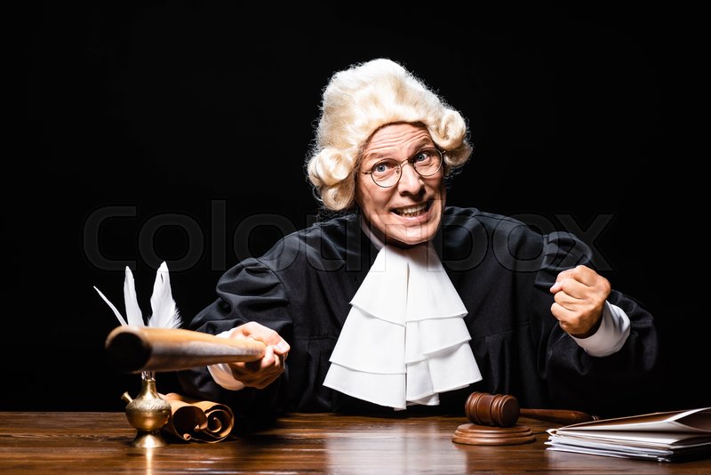 Angry judge in judicial robe and wig ... | Stock image | Colourbox