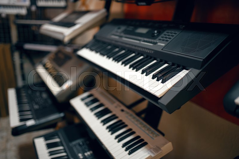 Digital synthesizers on showcase in ... | Stock image | Colourbox