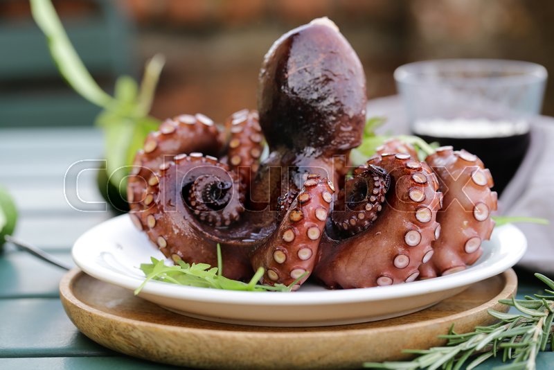 Natural fresh octopus with herbs and ... | Stock image | Colourbox