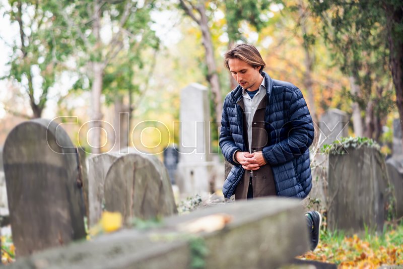 Someone Mourning At A Grave