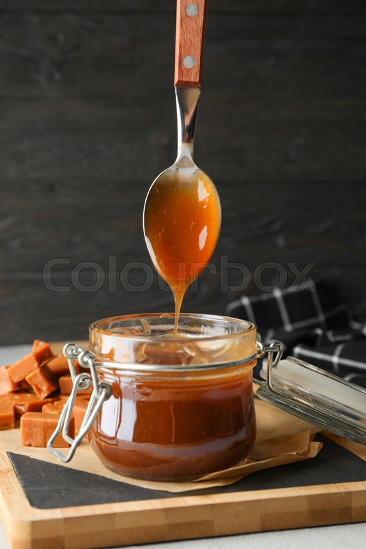 Glass jar with salted caramel and ... | Stock image | Colourbox