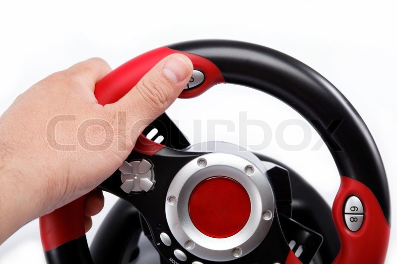 The hand on the steering wheel computer ... | Stock image | Colourbox