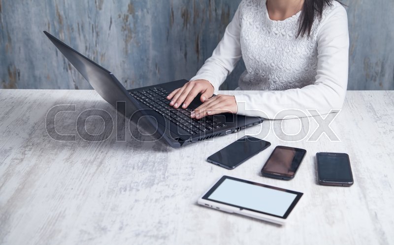 Business girl using laptop in office. | Stock image | Colourbox