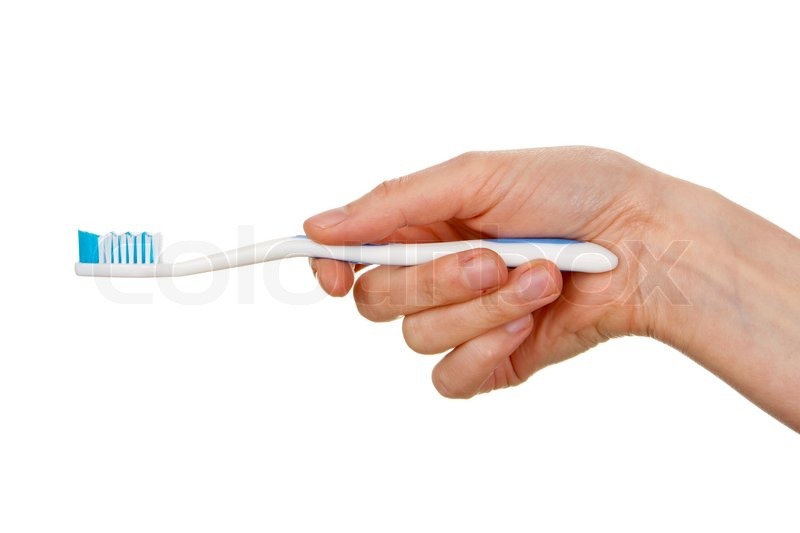 Woman's hand holding toothbrush | Stock image | Colourbox
