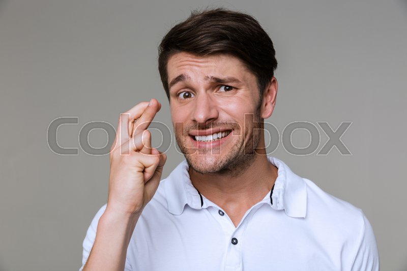 Photo of a nervous young man posing ... | Stock image | Colourbox