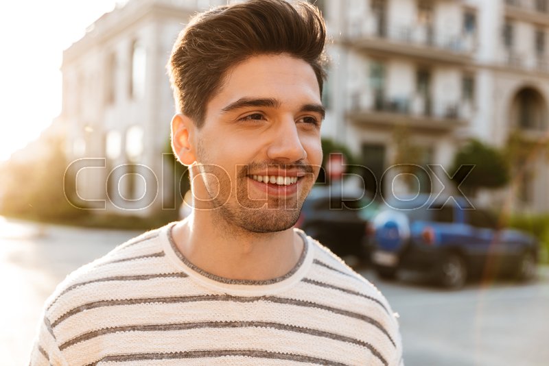 Image of pleased masculine man smiling ... | Stock image | Colourbox