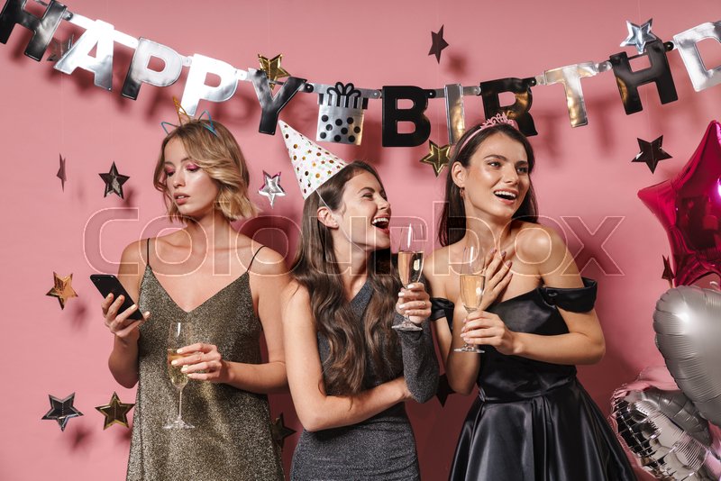 Image of three happy party girls in ... | Stock image | Colourbox