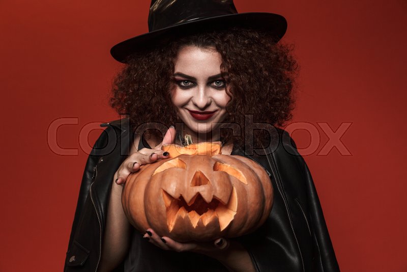 Image of curly witch girl in halloween ... | Stock image | Colourbox