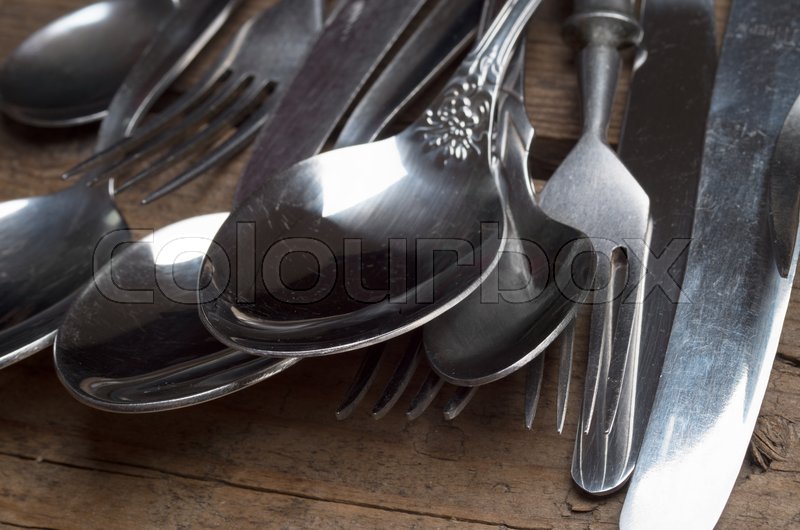 Vintage used cutlery on dark brown ... | Stock image | Colourbox