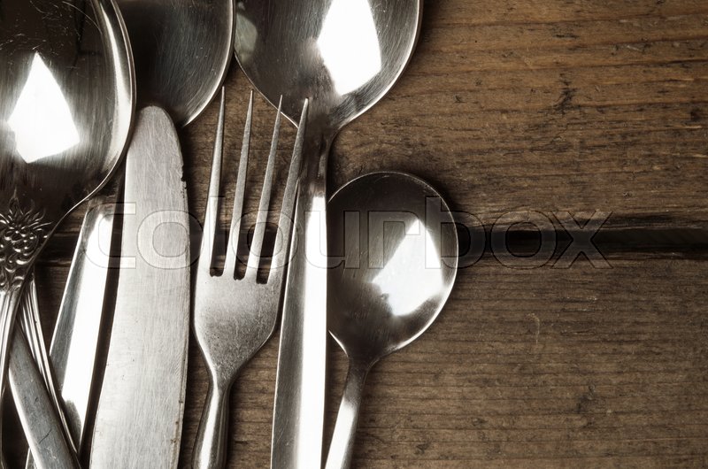 Vintage used cutlery on dark brown ... | Stock image | Colourbox