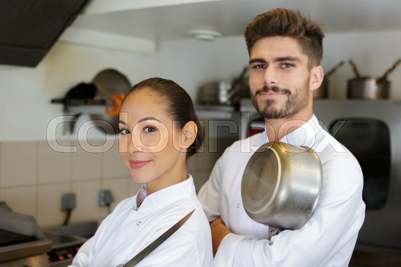 Male and female kitchen staff posing | Stock image | Colourbox