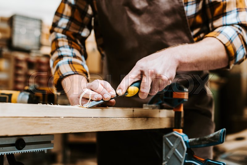 Cropped view of woodworker holding ... | Stock image | Colourbox