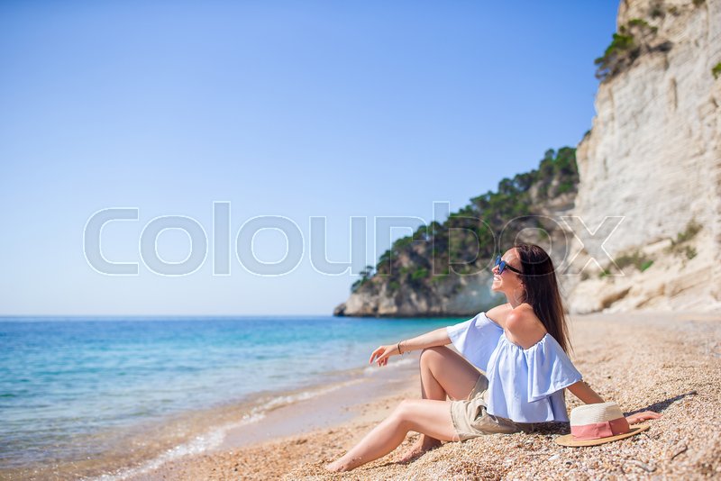 Young beautiful woman relaxing at empty ... | Stock image | Colourbox