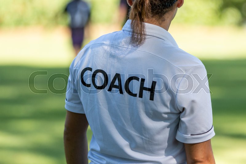 Back view of a female sport coach ... | Stock image | Colourbox