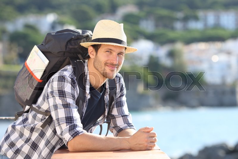 Relaxed tourist looking at camera on ... | Stock image | Colourbox