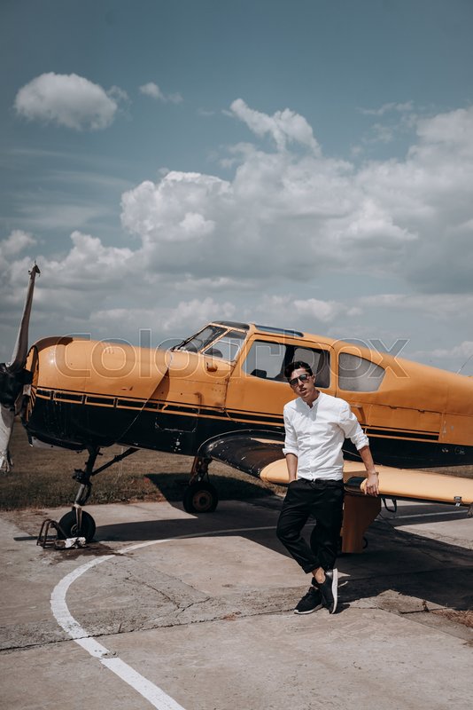 A man standing on the background of a ... | Stock image | Colourbox