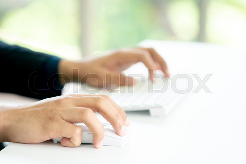 Male Hands Clicking Wireless Computer ... | Stock image | Colourbox
