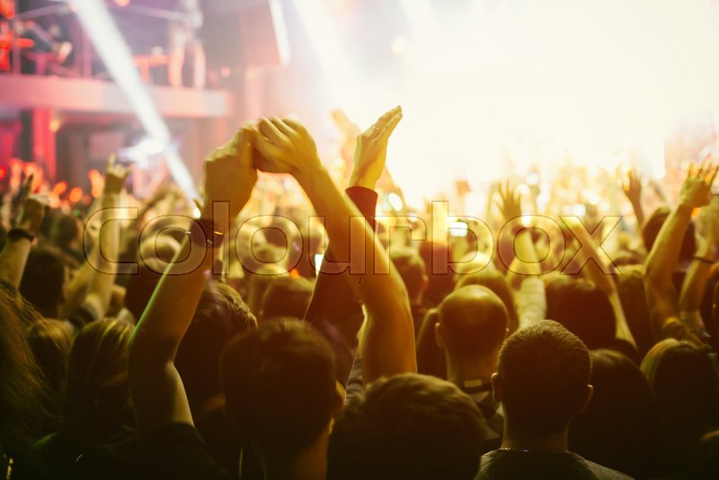 Crowd of spectators having fun at a ... | Stock image | Colourbox