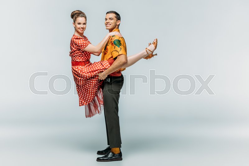 Cheerful man holding woman while ... | Stock image | Colourbox