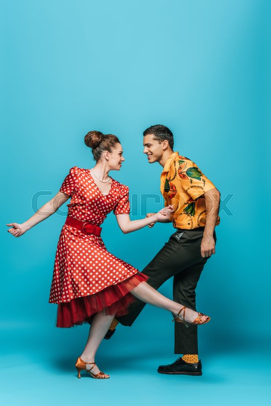 Smiling dancers looking at each other ... | Stock image | Colourbox