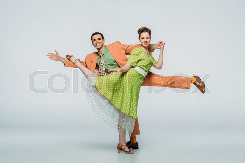 Happy dancers looking at camera while ... | Stock image | Colourbox