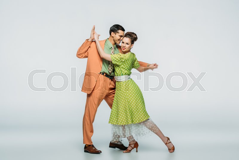 Stylish dancers holding hands while ... | Stock image | Colourbox