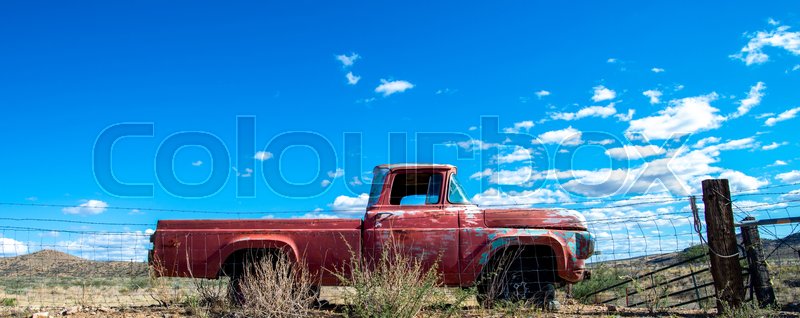 Old rusty red car fading in time | Stock image | Colourbox